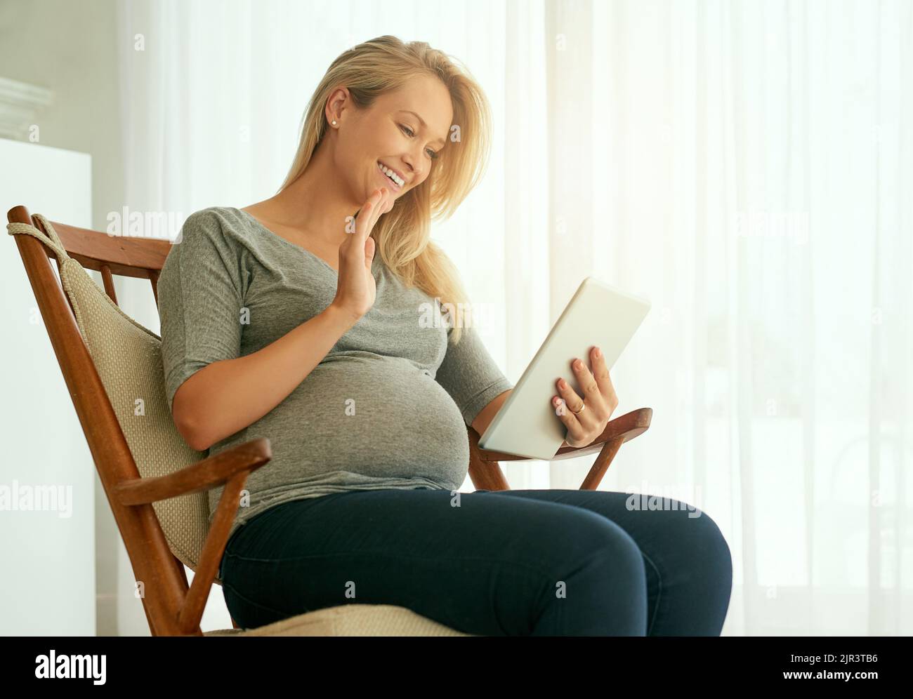 Pregnant woman sitting on chair hi-res stock photography and images - Alamy