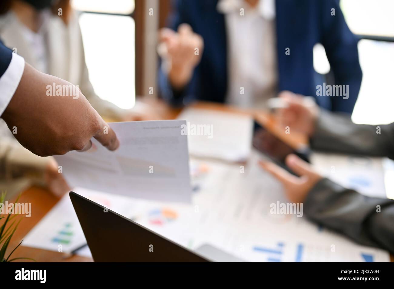 A professional male financial consultant giving a financial investment ...