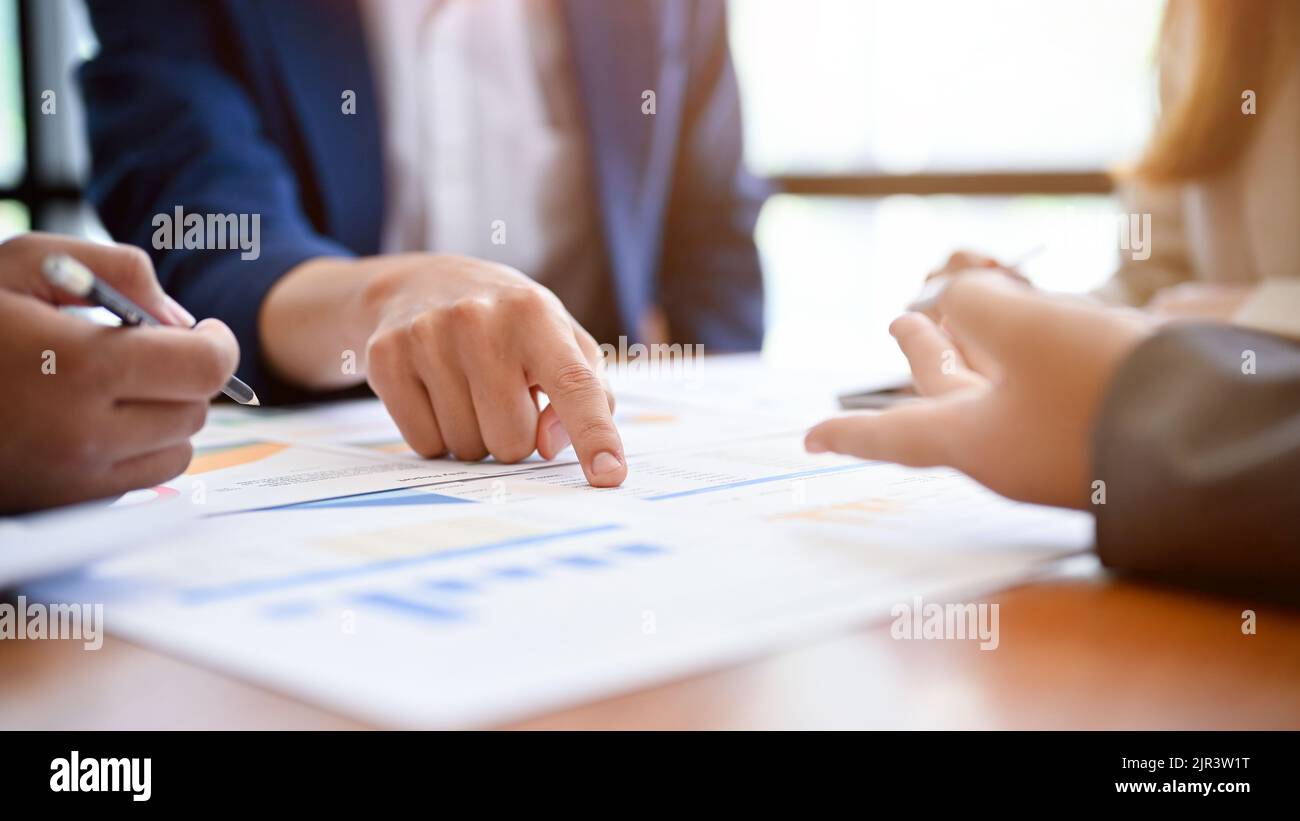 A group of talented businesspeople discussing and collaborating on ...