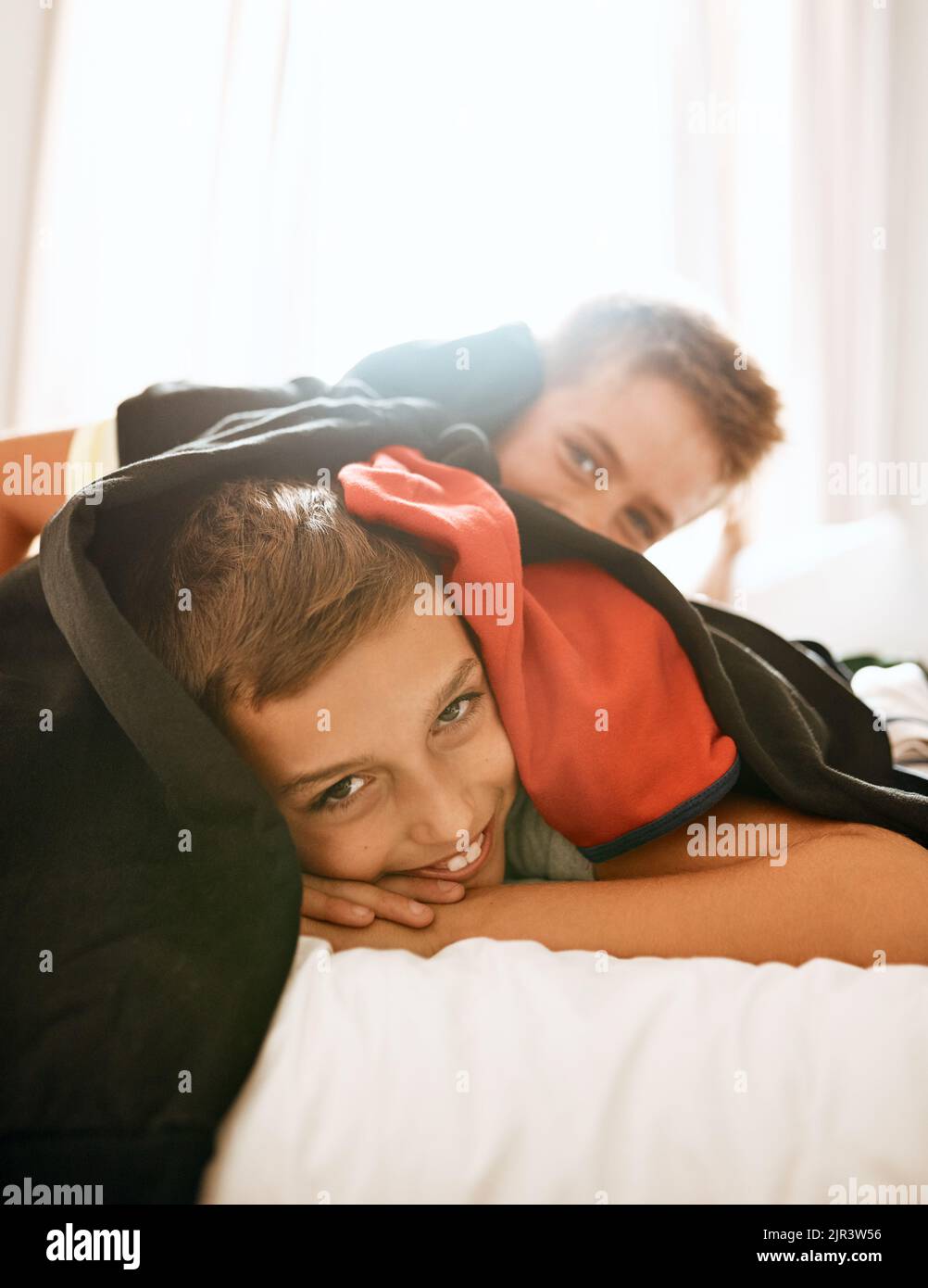 All siblings have their silly moments. Portrait of two little brothers ...