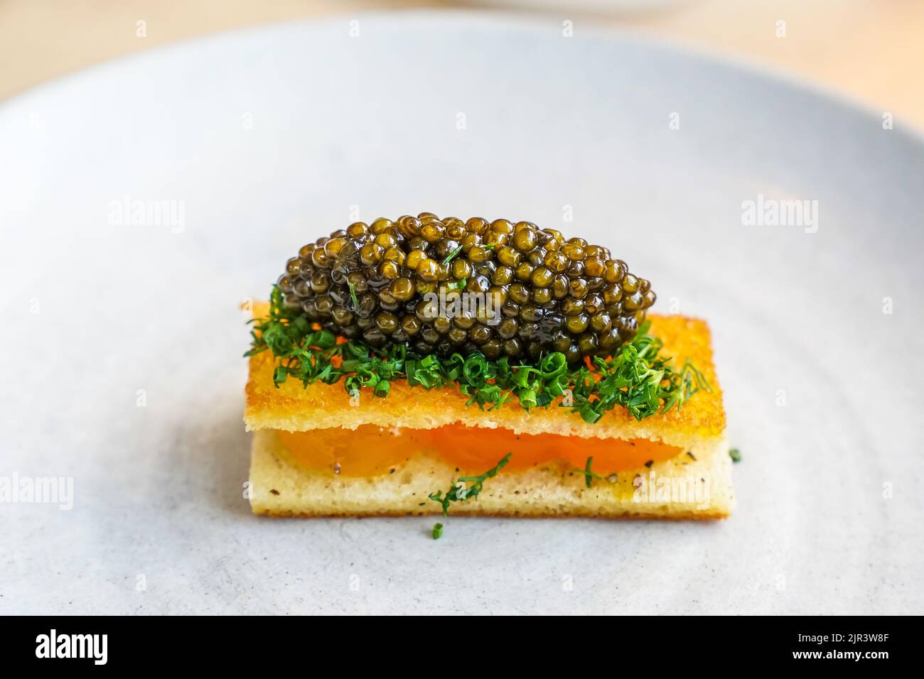 Egg Toast with Caviar and Herbs in gourmet restaurant Stock Photo - Alamy