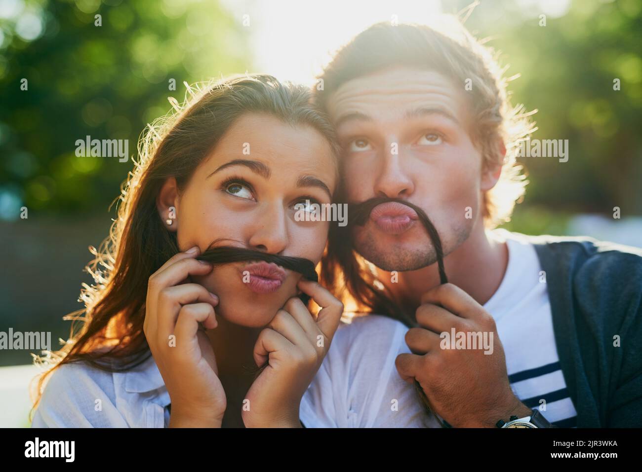 Were totally rocking these staches. a young couple enjoying a silly ...