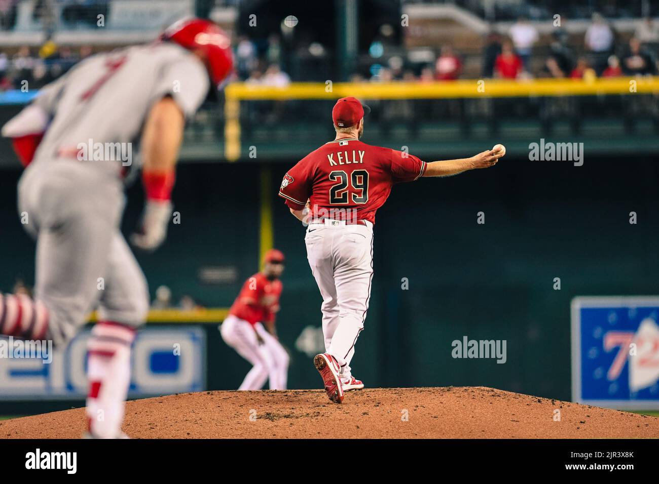 Arizona Diamondbacks pitcher Merrill Kelly (29) attempts to turn a ...