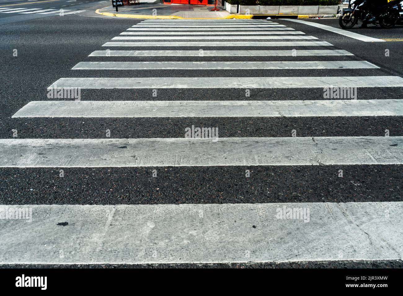 A Zebra crossing stripes on a road Stock Photo - Alamy