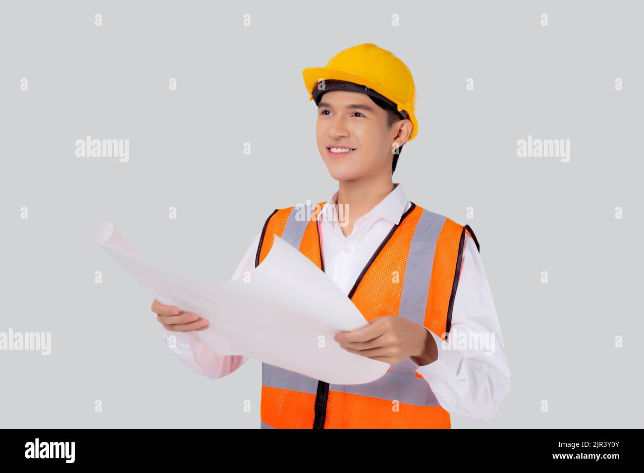 Portrait young asian man is engineer wearing helmet holding and looking ...