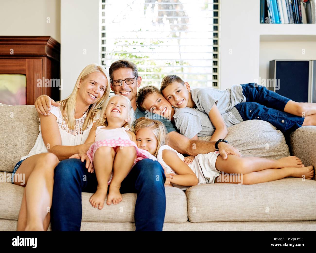 Our growing family. Portrait of a happy family spending quality time ...