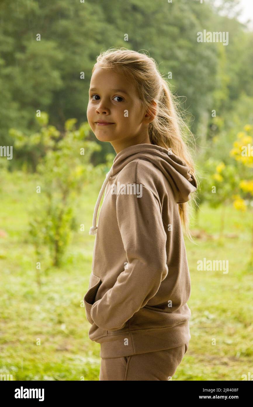 A girl in a sports suit. Blurred background Stock Photo - Alamy