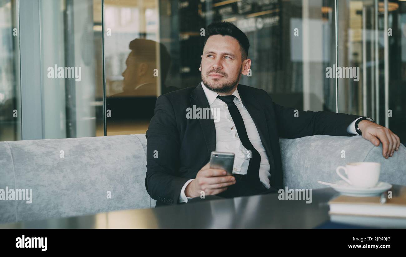 Smiling bearded Caucasian businessman in formal clothes smiling ...