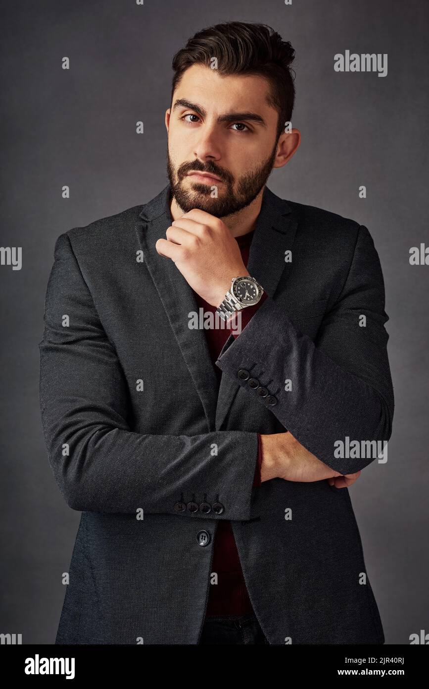 Suave is his signature. Studio portrait of a handsome young man posing ...