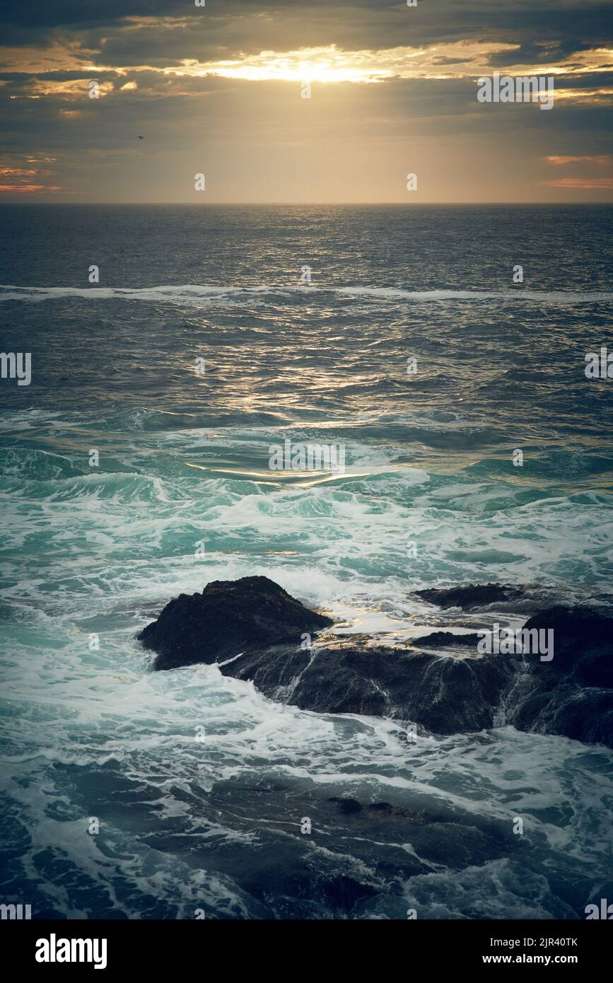 Let the sea set you free. ocean waves crashing against boulders on the ...