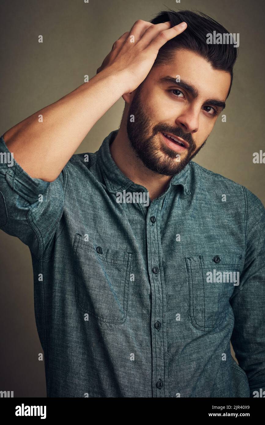 Wear your beard with style. Studio shot of a handsome young man posing ...