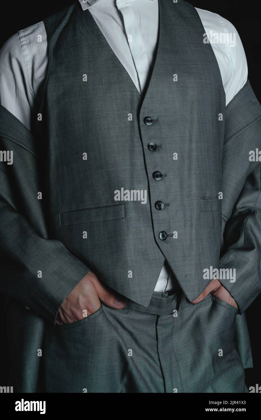 Chest of a man dressed in a suit. Business suit on a black background ...