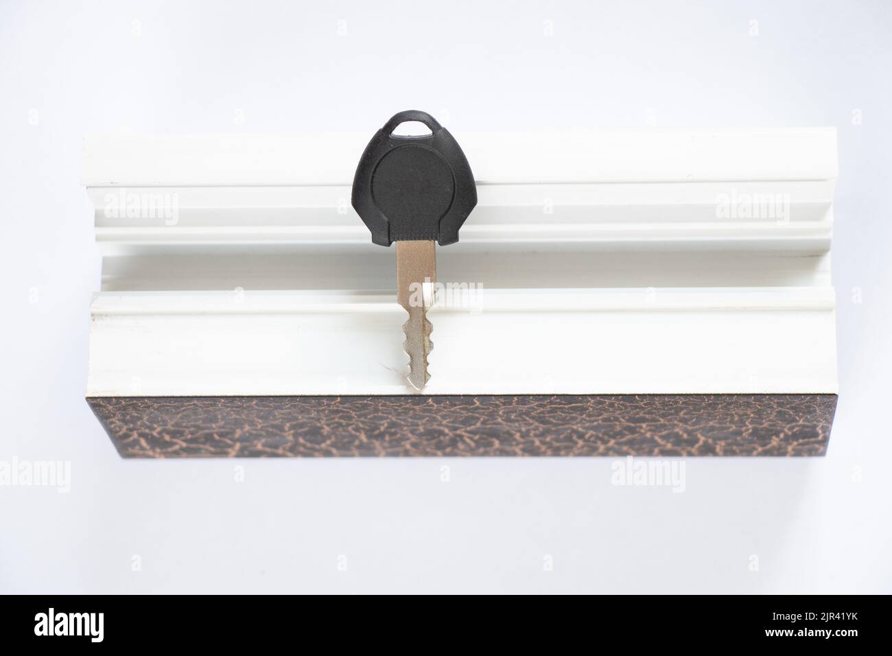 aluminum window frame as a sample and keys to the lock, sectional ...