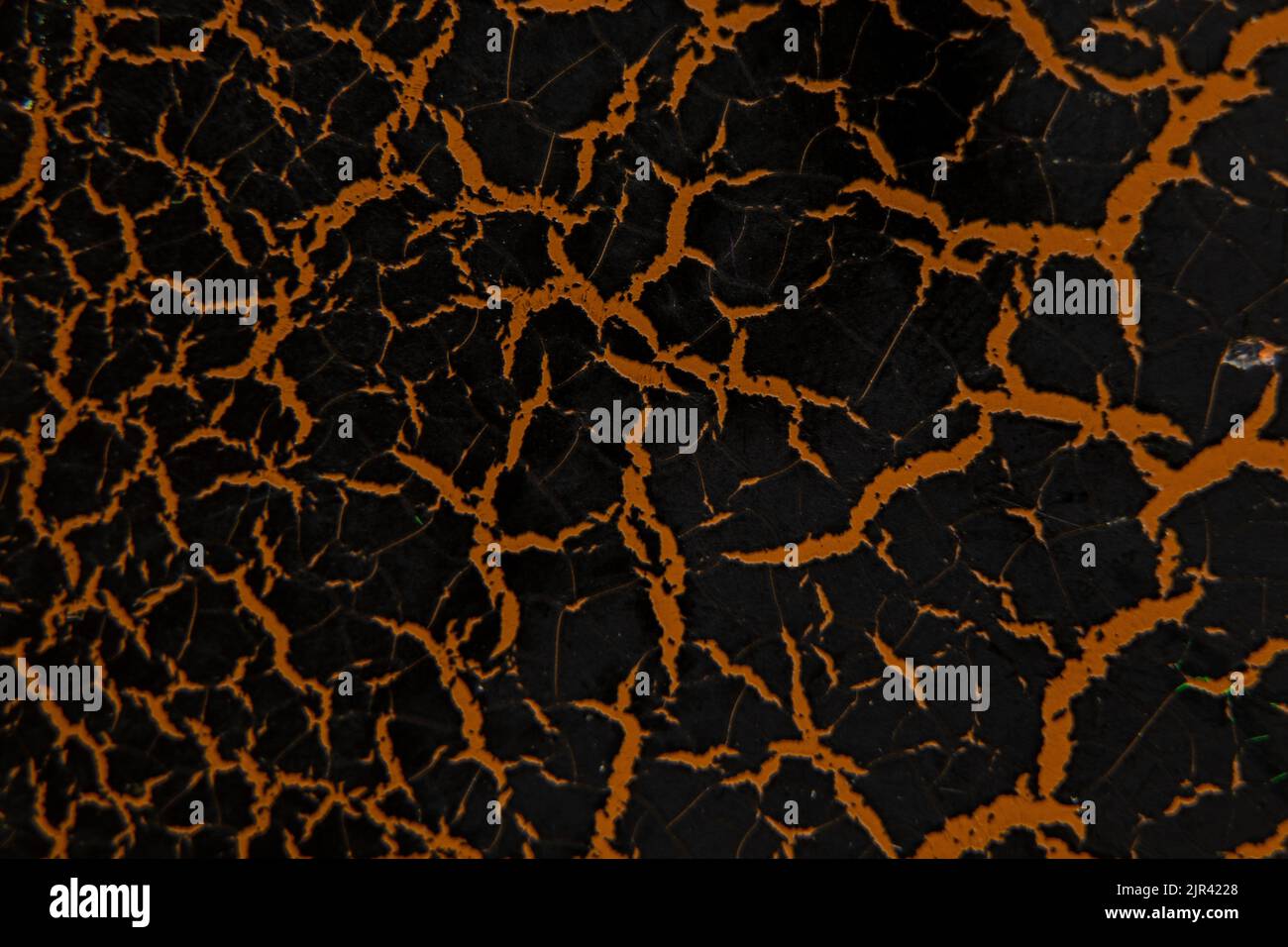 brown paint with cracked effect as background close-up, brown paint ...