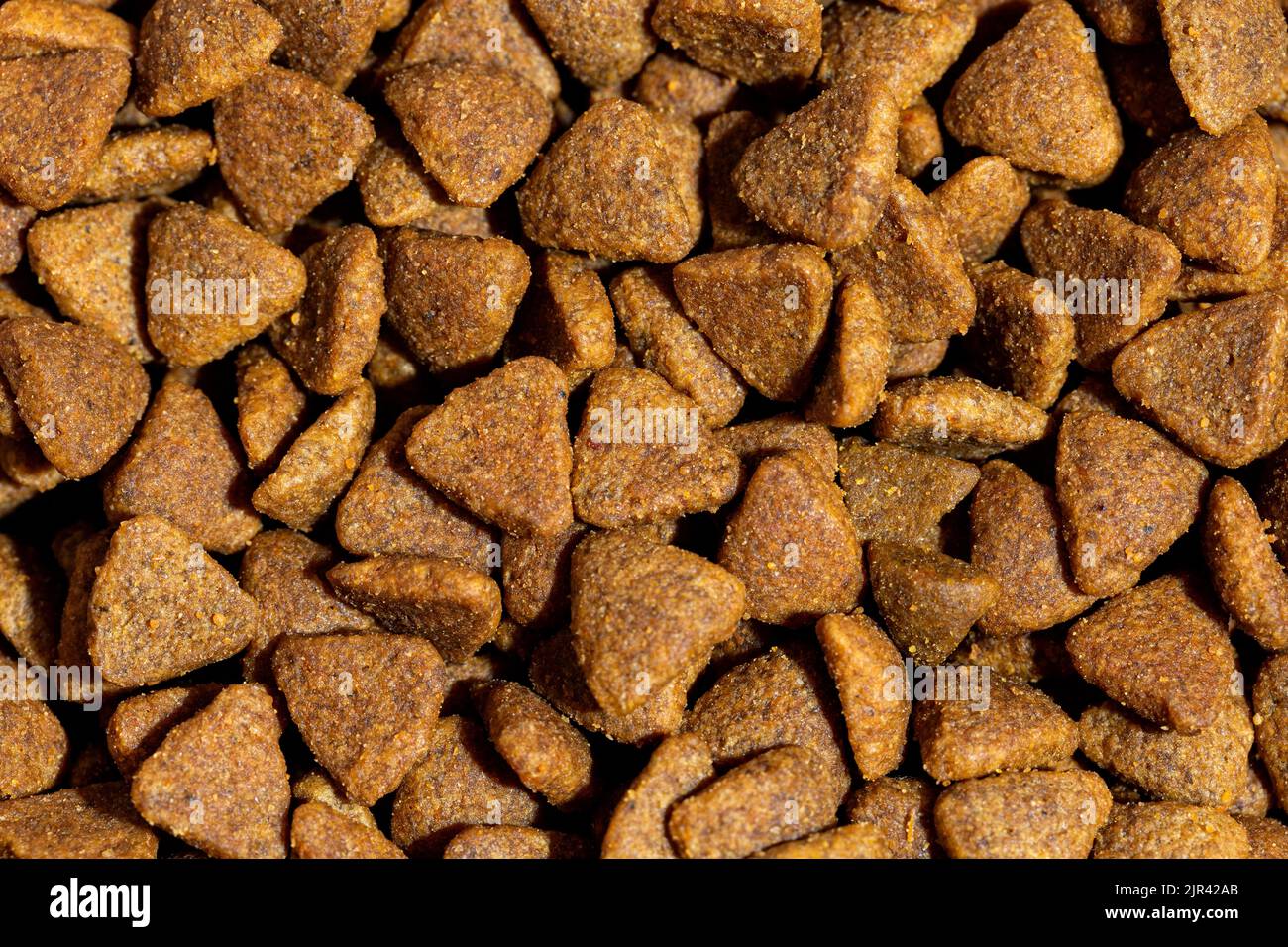 Dog or cat food or kibble shot up close. Top view background Stock ...