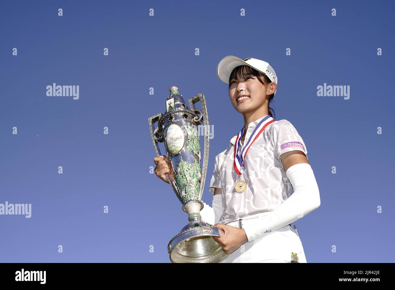 Japan's Saki Baba celebrates with the trophy after winning the U.S ...
