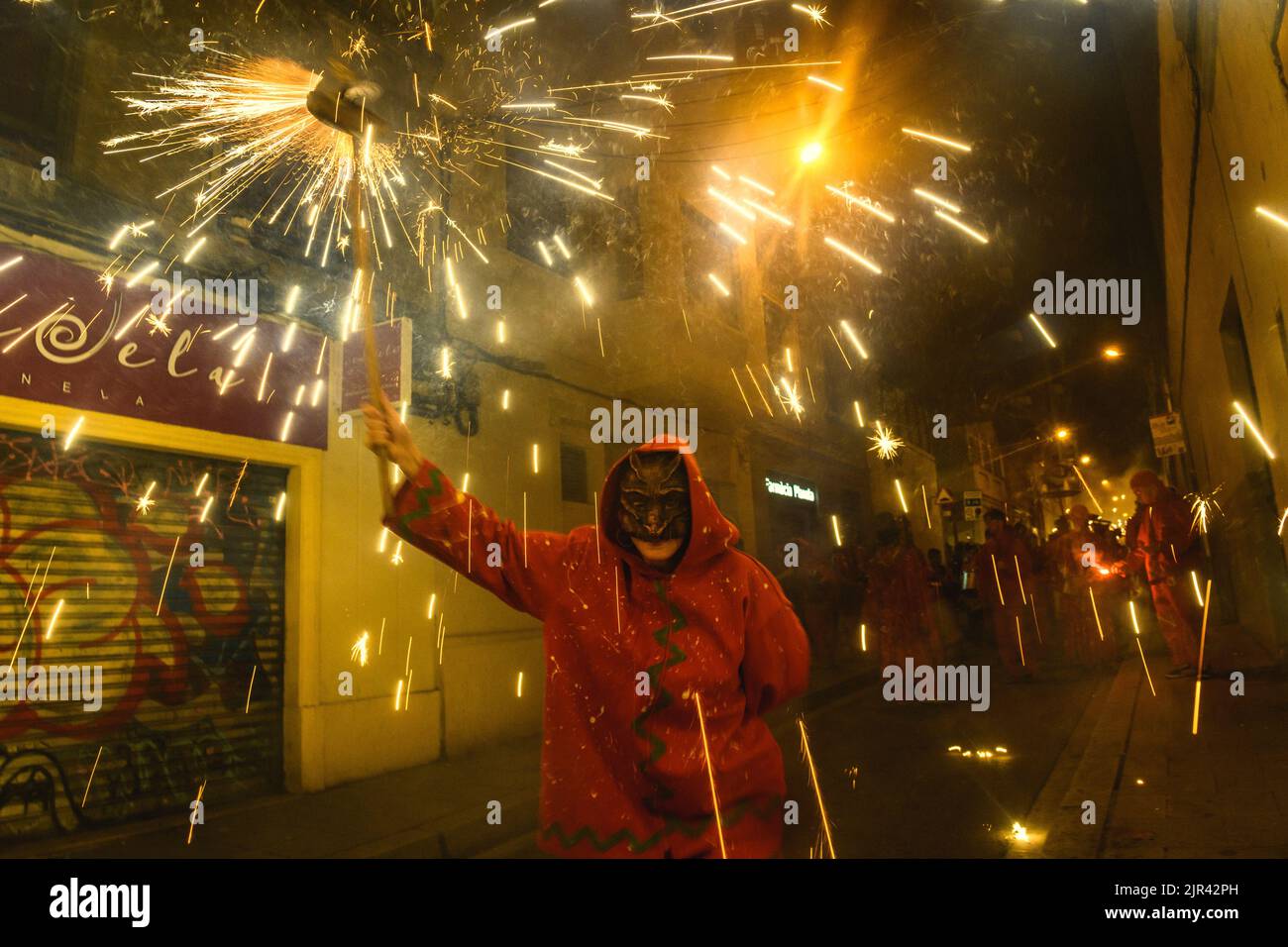 Barcelona, Spain. 22nd Aug, 2022. Fire runners in devil costumes dance ...