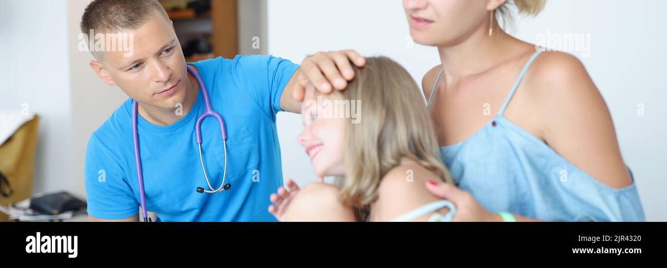 Doctor conducts medical examination of child in hotel rooms at resort ...