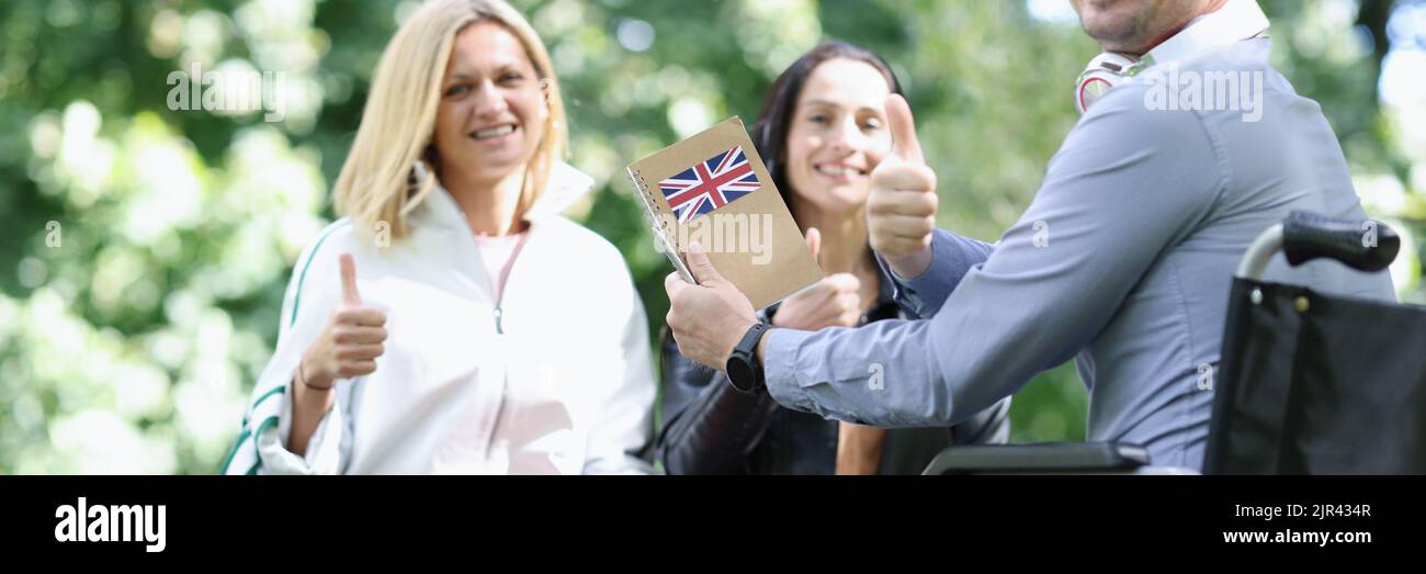 Group of young people are learning English in park Stock Photo - Alamy