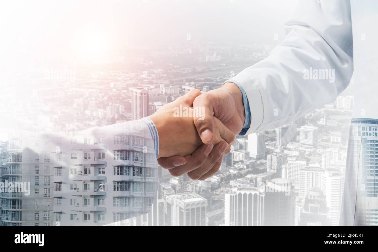 Handshake between nurse doctor hi-res stock photography and images - Alamy