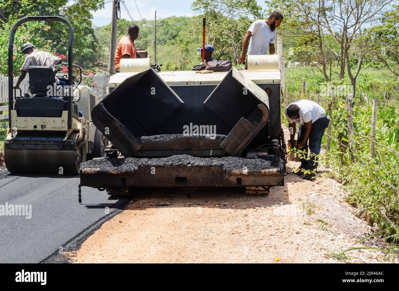 Men And Asphalt Equipment Repairing Road In Jamaica Stock Photo - Alamy