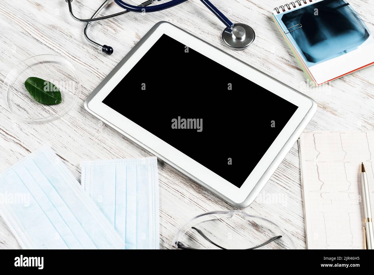 Mock up of doctors desktop with medical supplies Stock Photo - Alamy