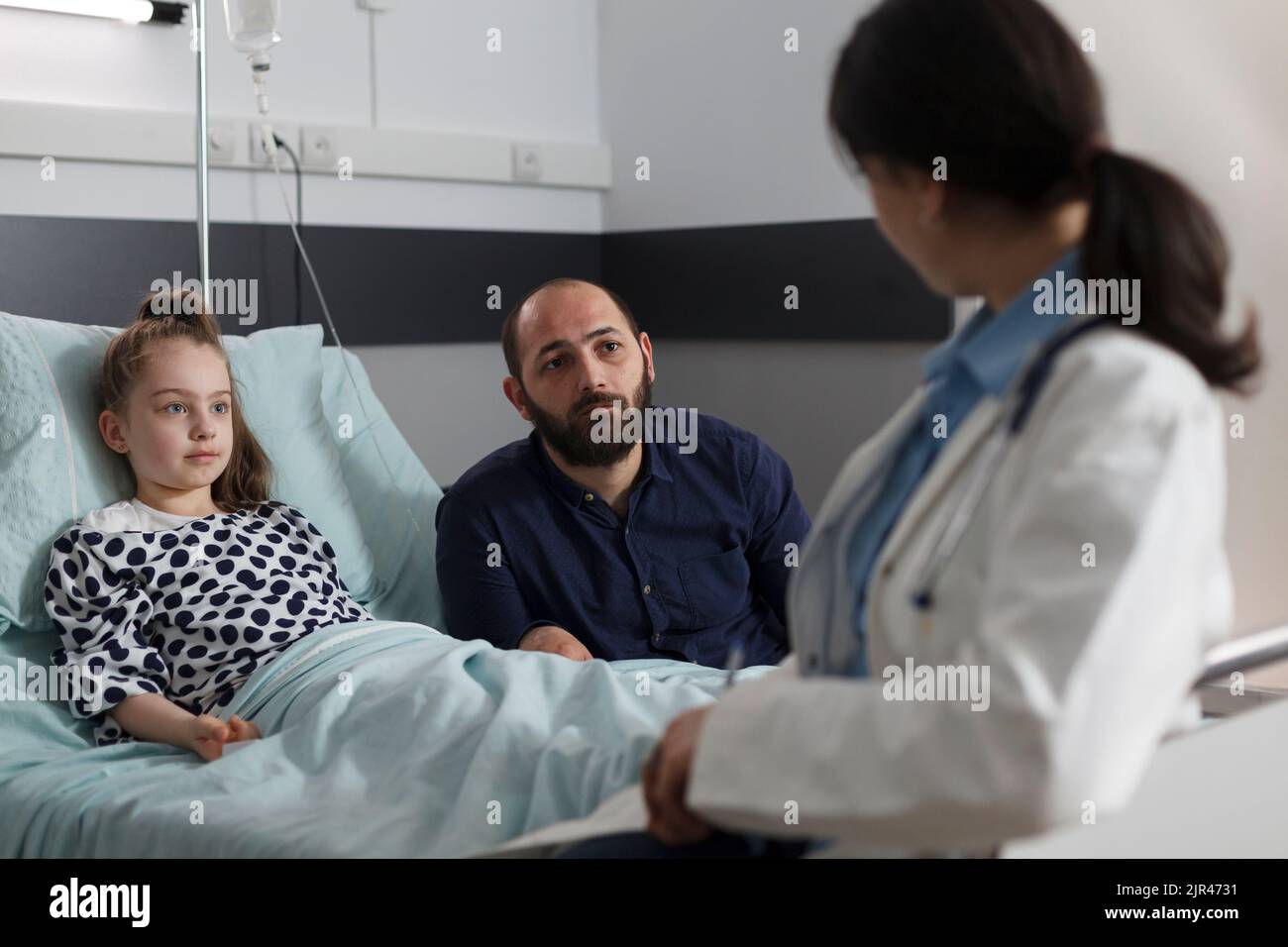General practitioner consulting unwell recovering kid sitting in ...