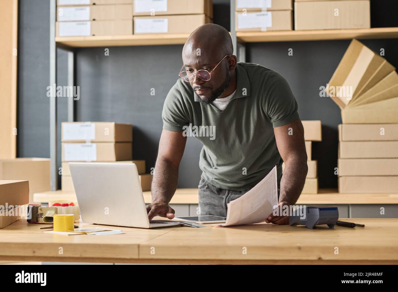 Serious african man concentrating hi-res stock photography and images ...