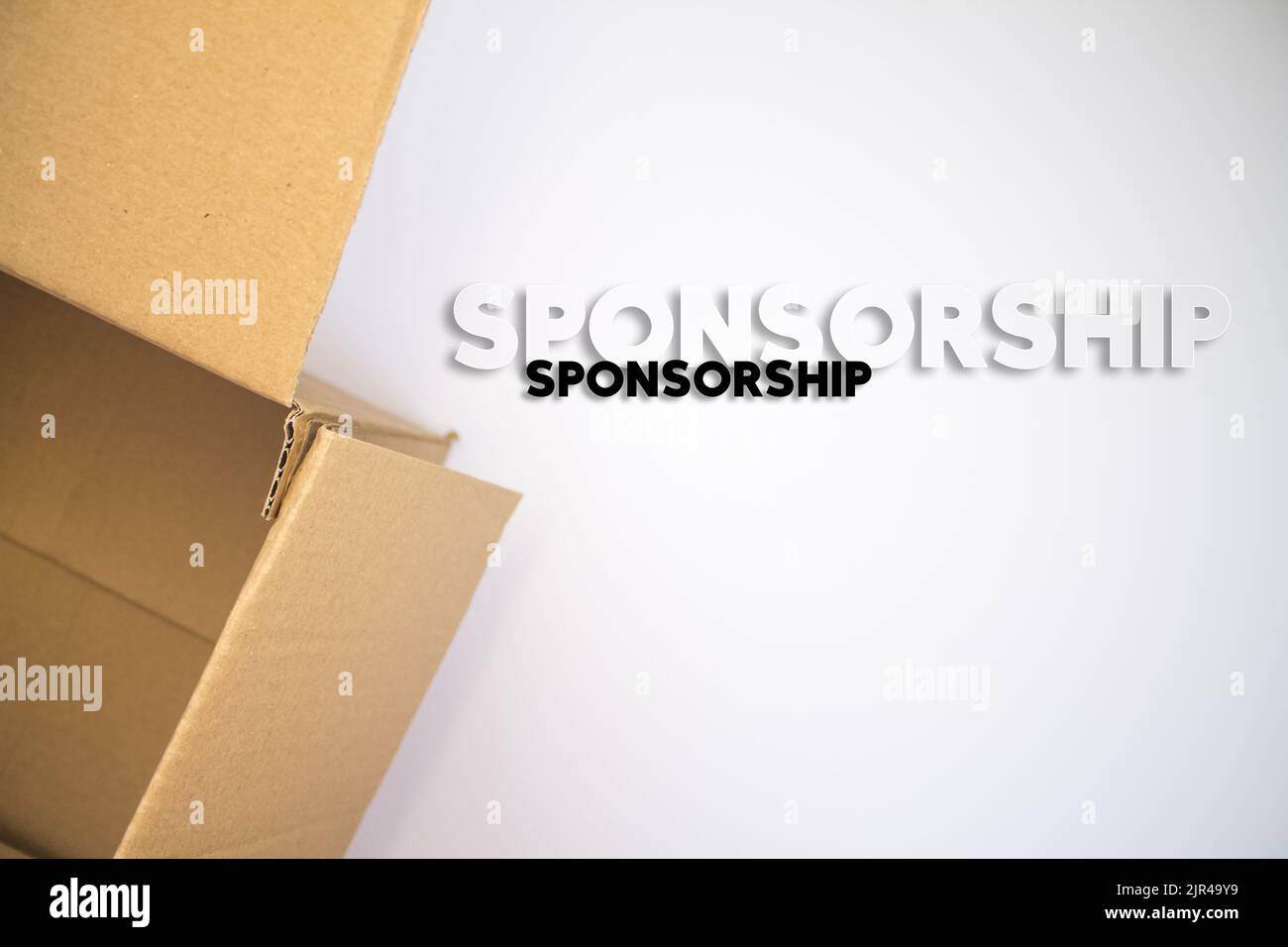 Sponsorship word with cardboard box. Brown folded cardbox Stock Photo ...