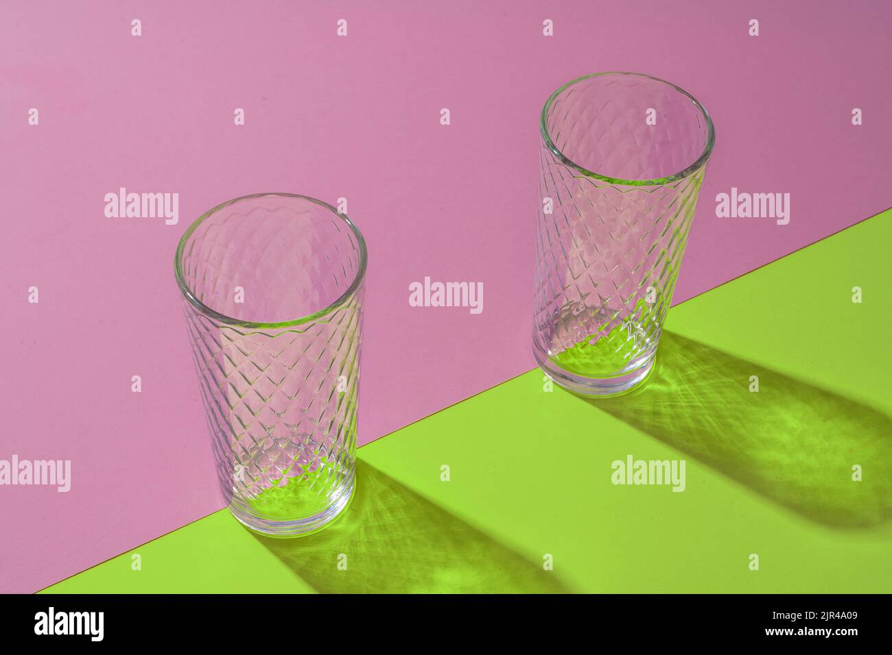 Empty transparent glass on a color background with copyspace Stock ...