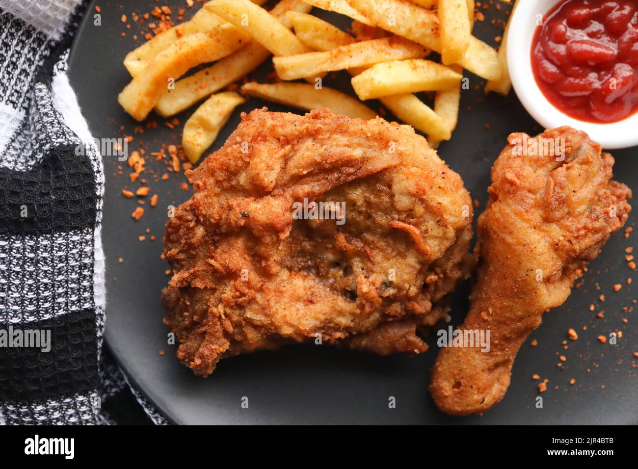 Battered fried chicken and chips. Fried chicken with a side of hot ...