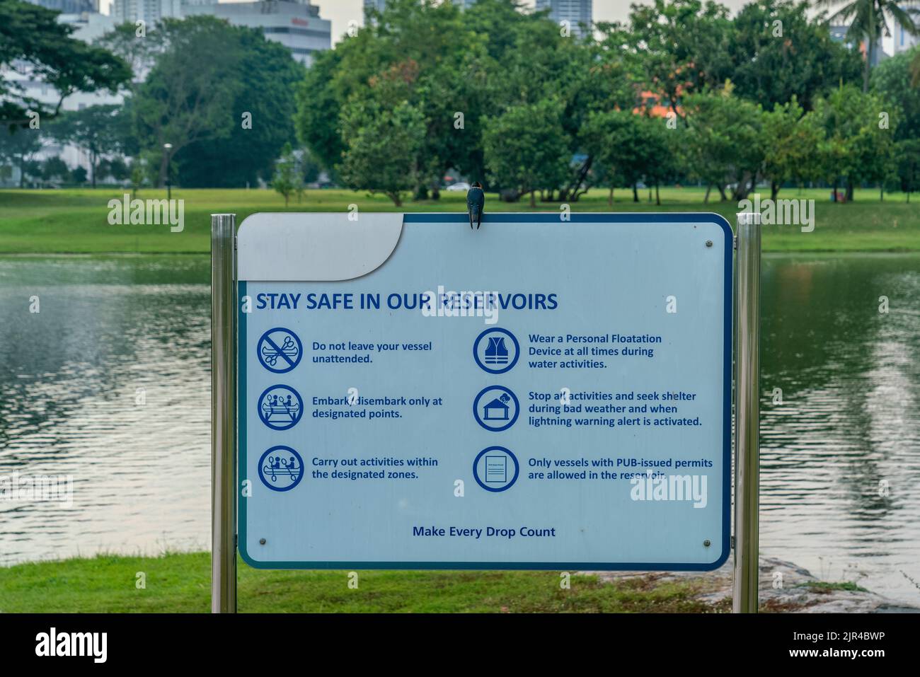 A caution sign warns against prohibited activities and rules of 'Stay ...