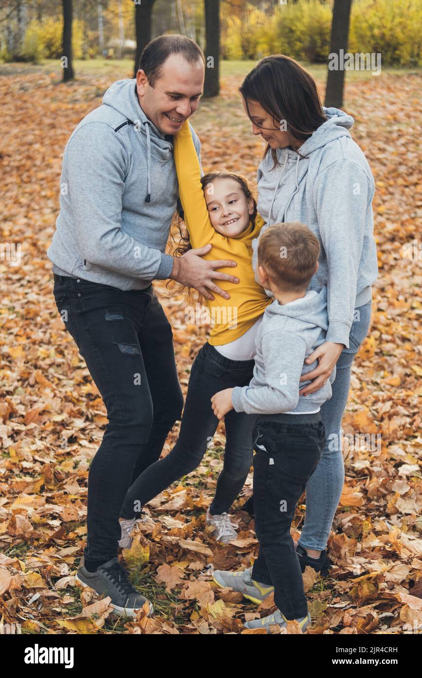 Portrait four happy family members hi-res stock photography and images ...
