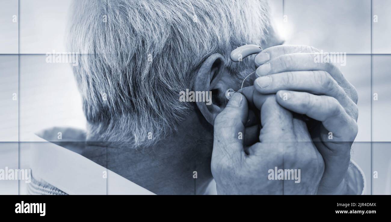 Senior man putting hearing aids, geometric pattern Stock Photo - Alamy
