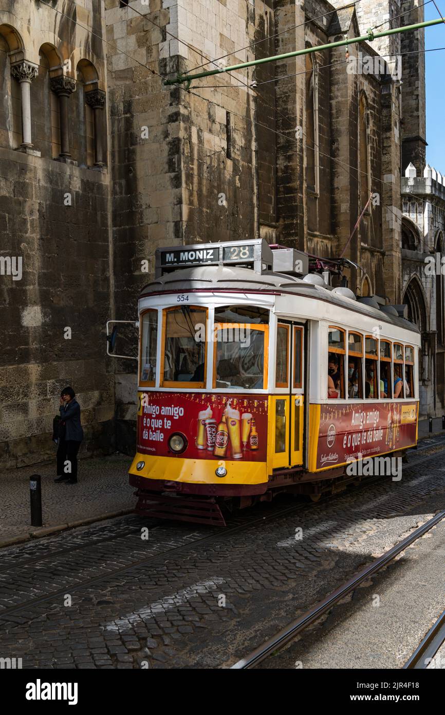 The famous Lisbon trams as they move through old Lisbon street Stock ...