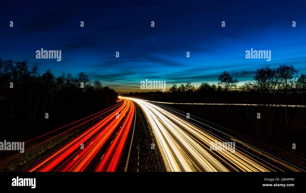 Motorway fast traffic light trails at night Stock Photo - Alamy