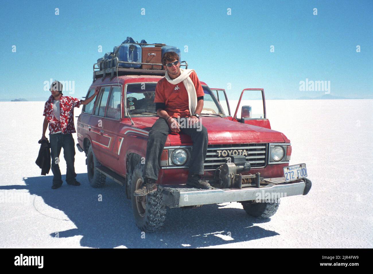The men with red vintage Toyota Land Cruiser in the Salar de Uyuni ...