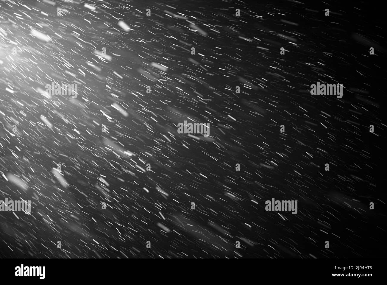 Snowflakes falling down on black background, heavy snow flakes isolated ...
