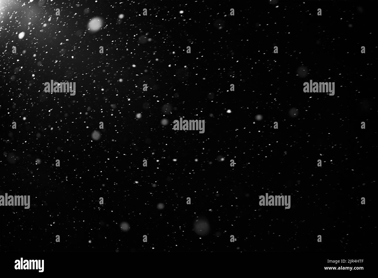 Snowflakes falling down on black background, heavy snow flakes isolated ...
