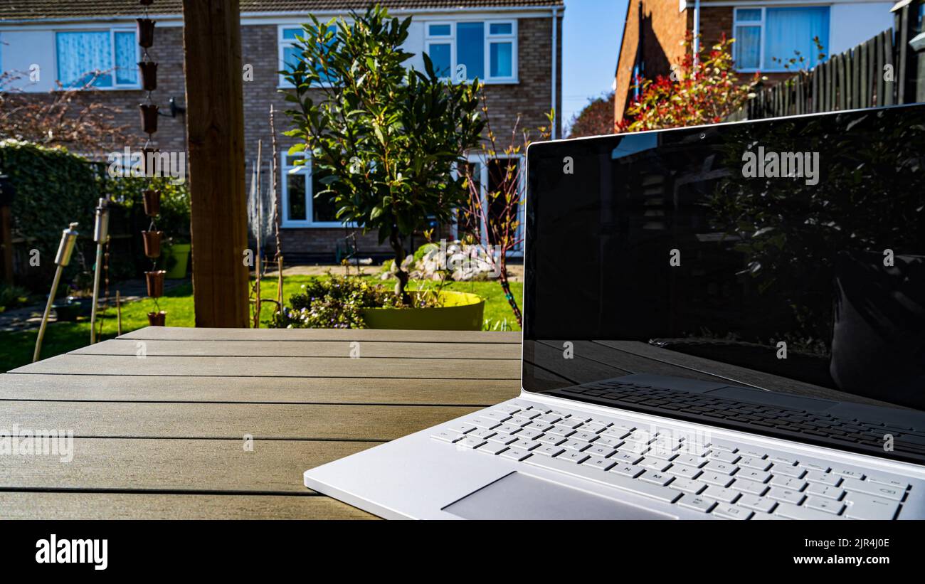 Working from home setup in a garden Stock Photo - Alamy