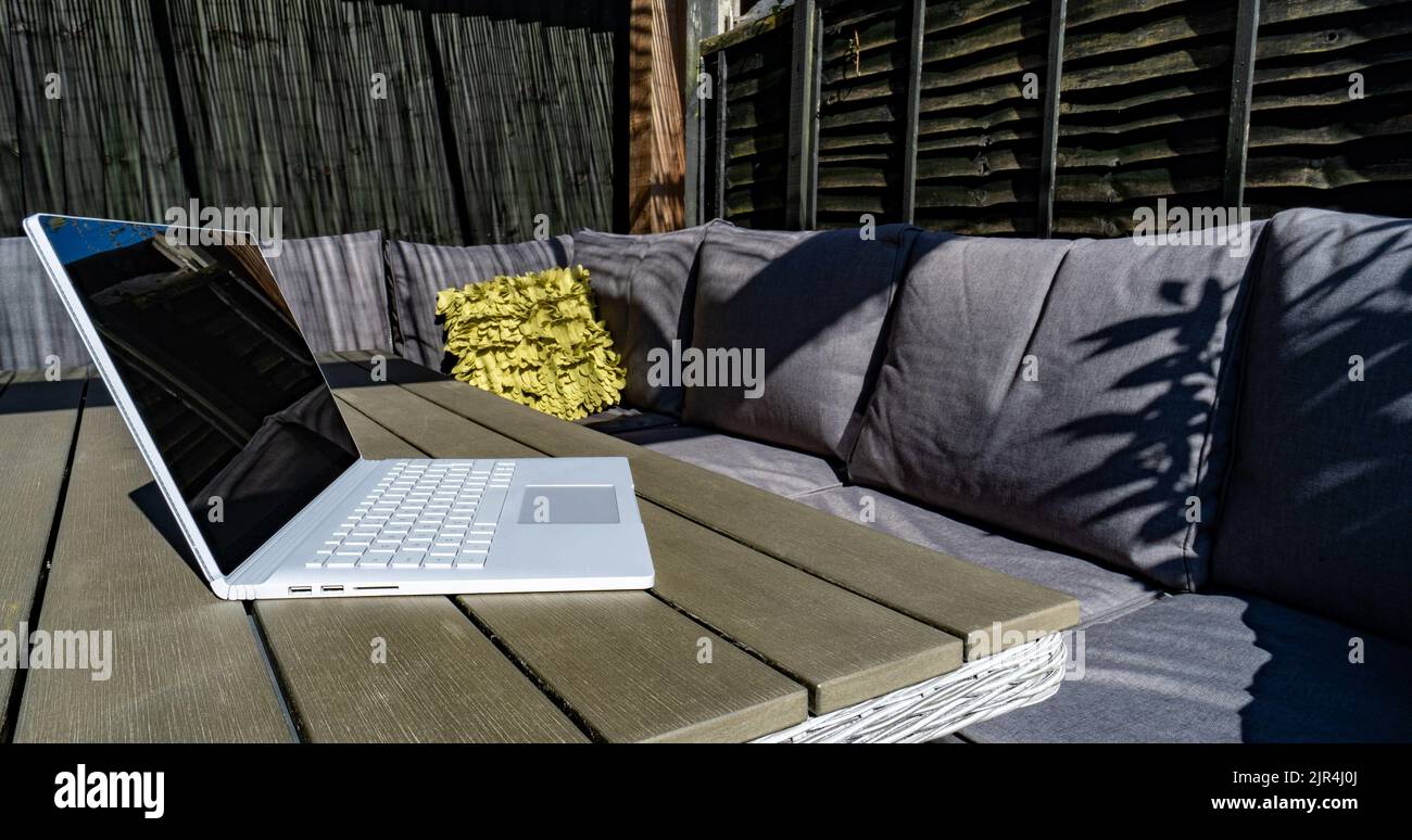 Working from home setup in a garden Stock Photo - Alamy