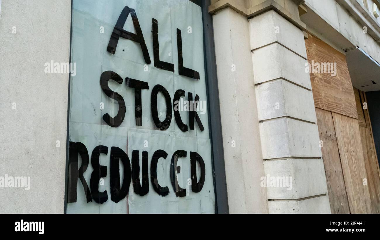 All Stock Reduced Sign on Empty Retail Storefront Stock Photo - Alamy