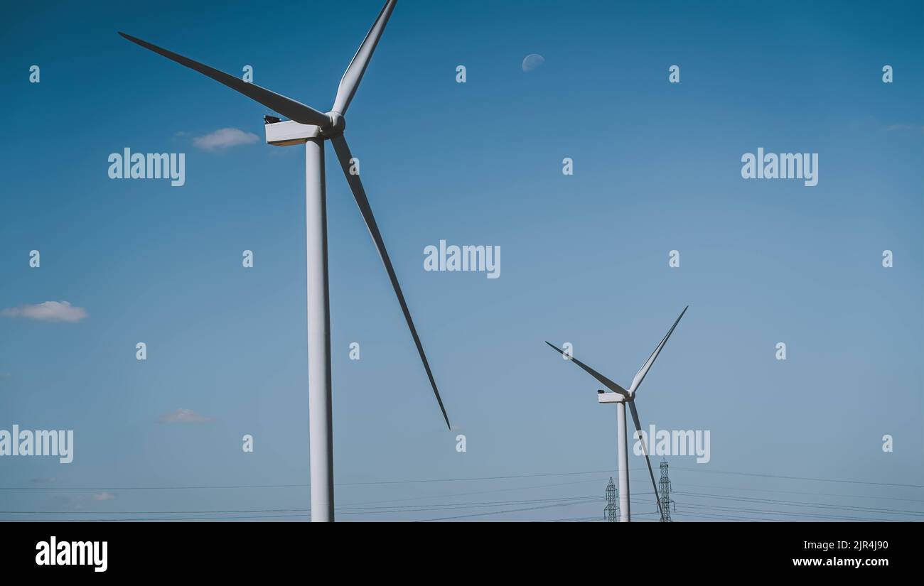 Wind turbine on blue sky with moon Stock Photo - Alamy