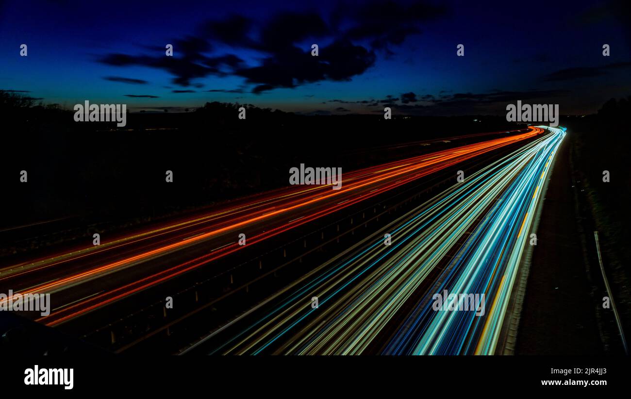 Motorway fast traffic light trails at night Stock Photo - Alamy