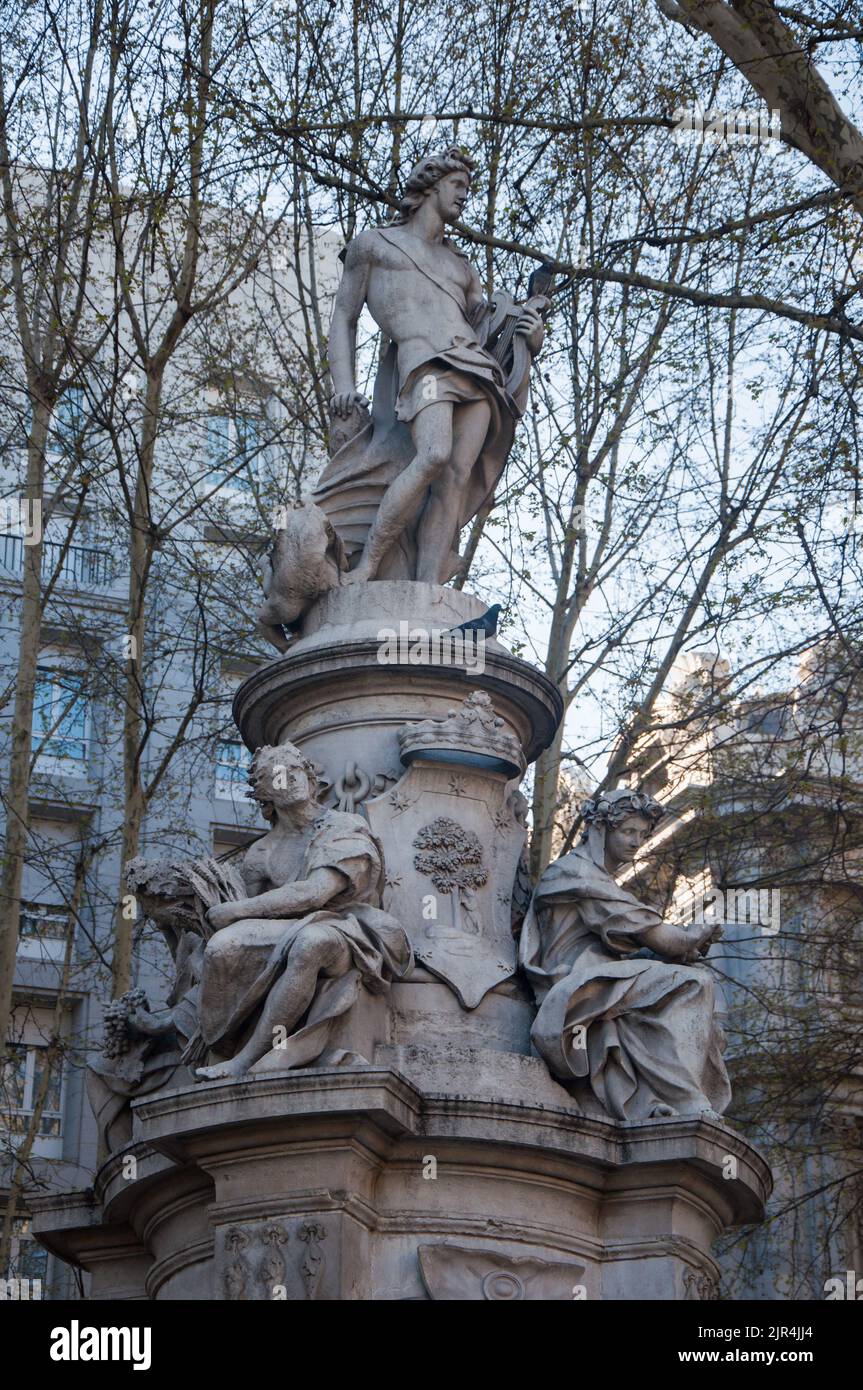 A vertical shot of the statue of Appolo in a park in Madrid, Spain ...