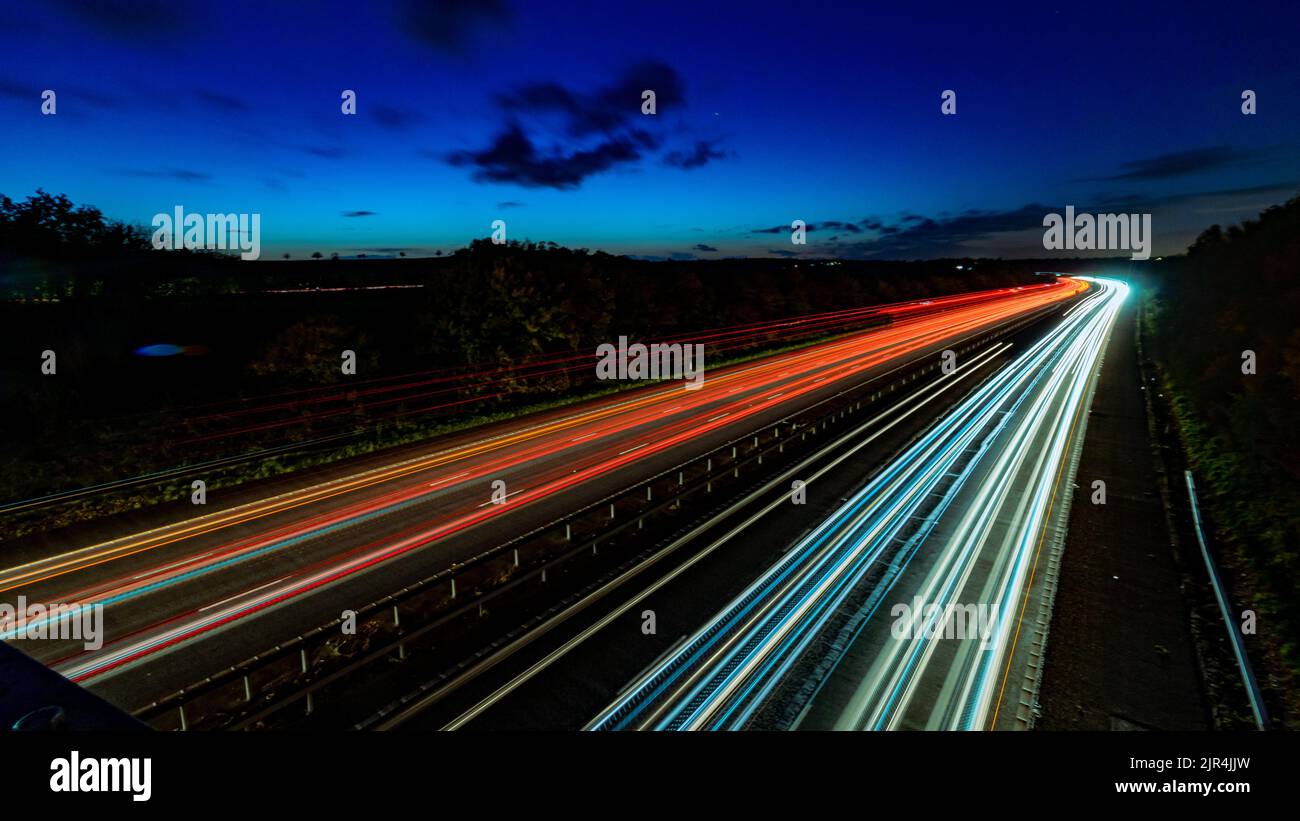 Motorway fast traffic light trails at night Stock Photo - Alamy