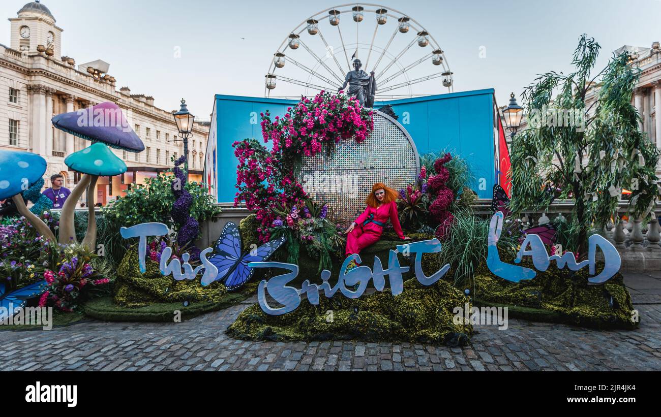 A performing artist at the entrance to the This Bright Land at Somerset ...