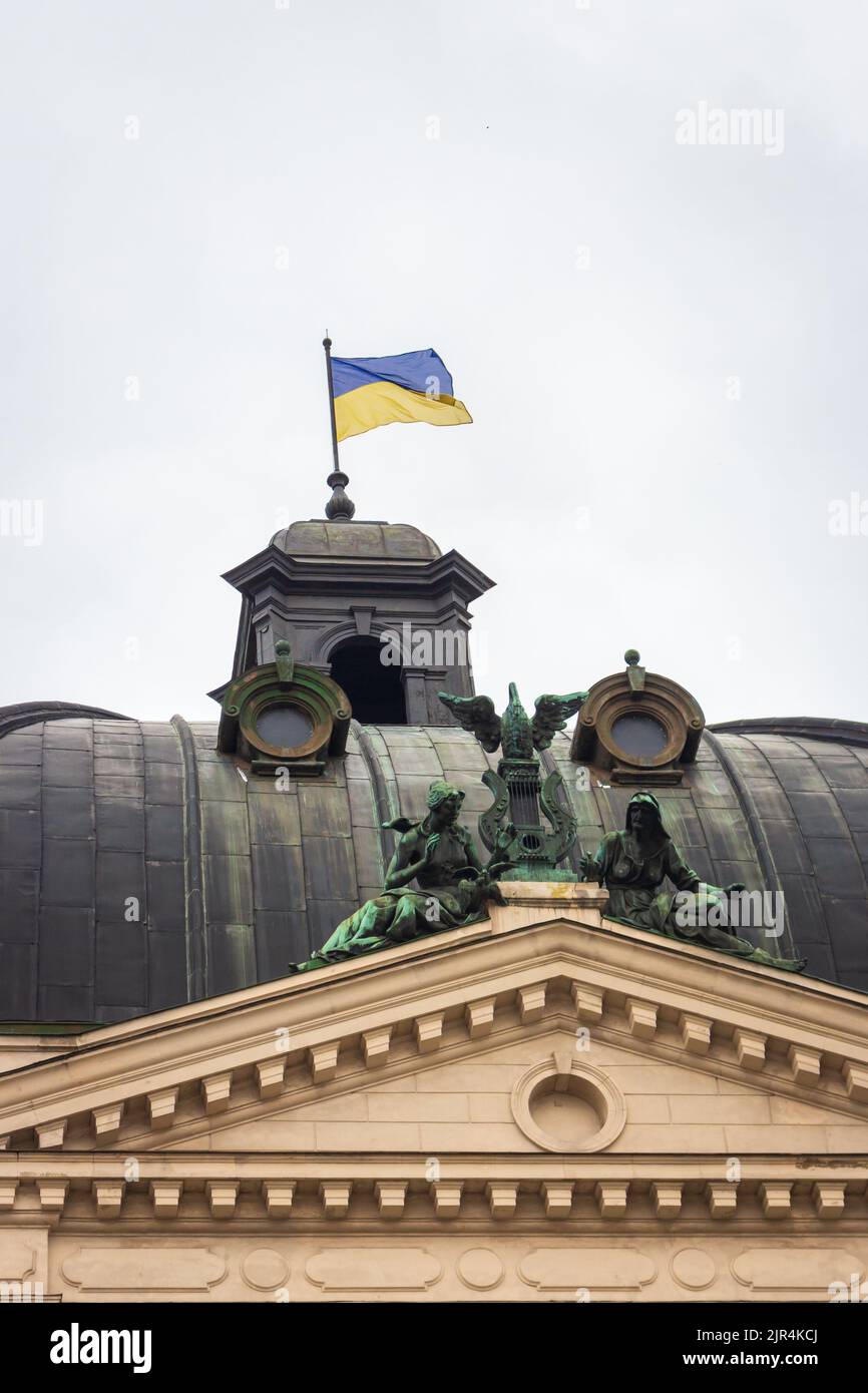 Ukrainian flag on the roof. Lviv landmark, Ukraine. Patriotism concept ...