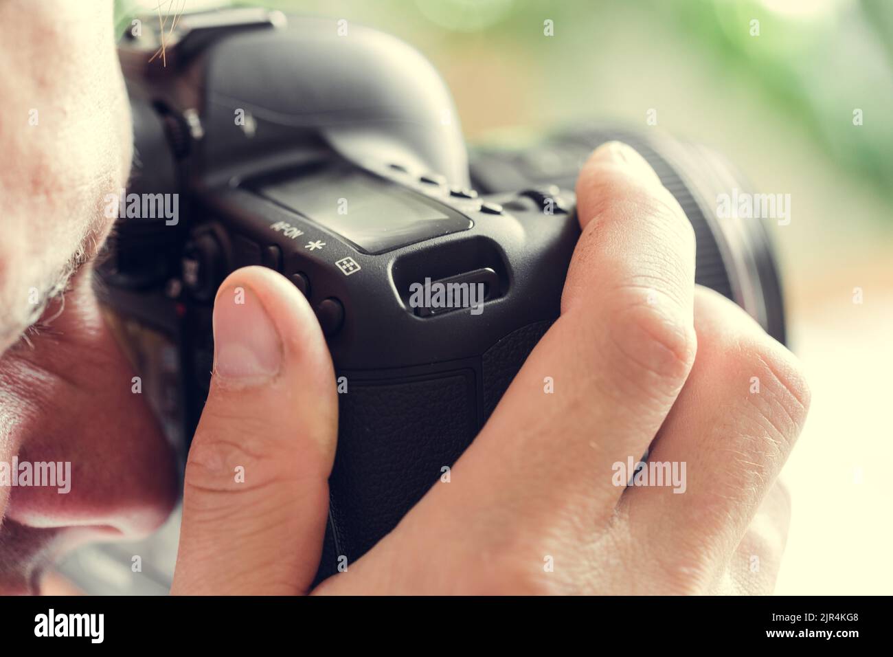 photographer with camera in hand Stock Photo - Alamy