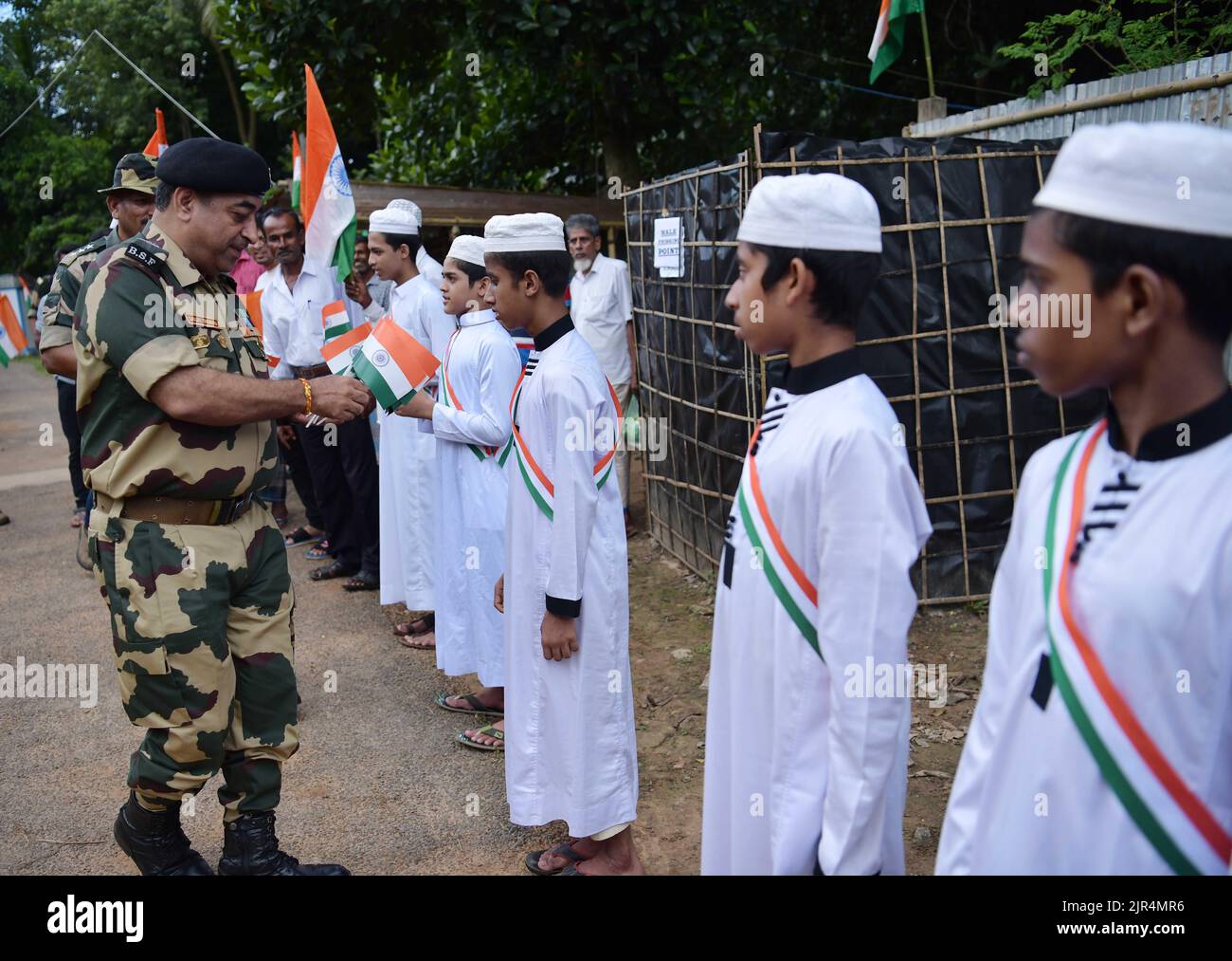 BSF (Border Security Force) officials distributes Indian flag to ...